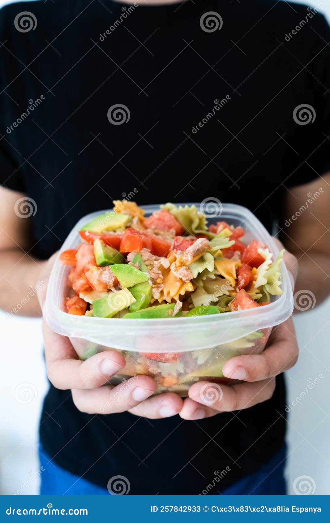 Hands Holding a Healthy Mediterranean Pasta Salad Tupperware Stock ...