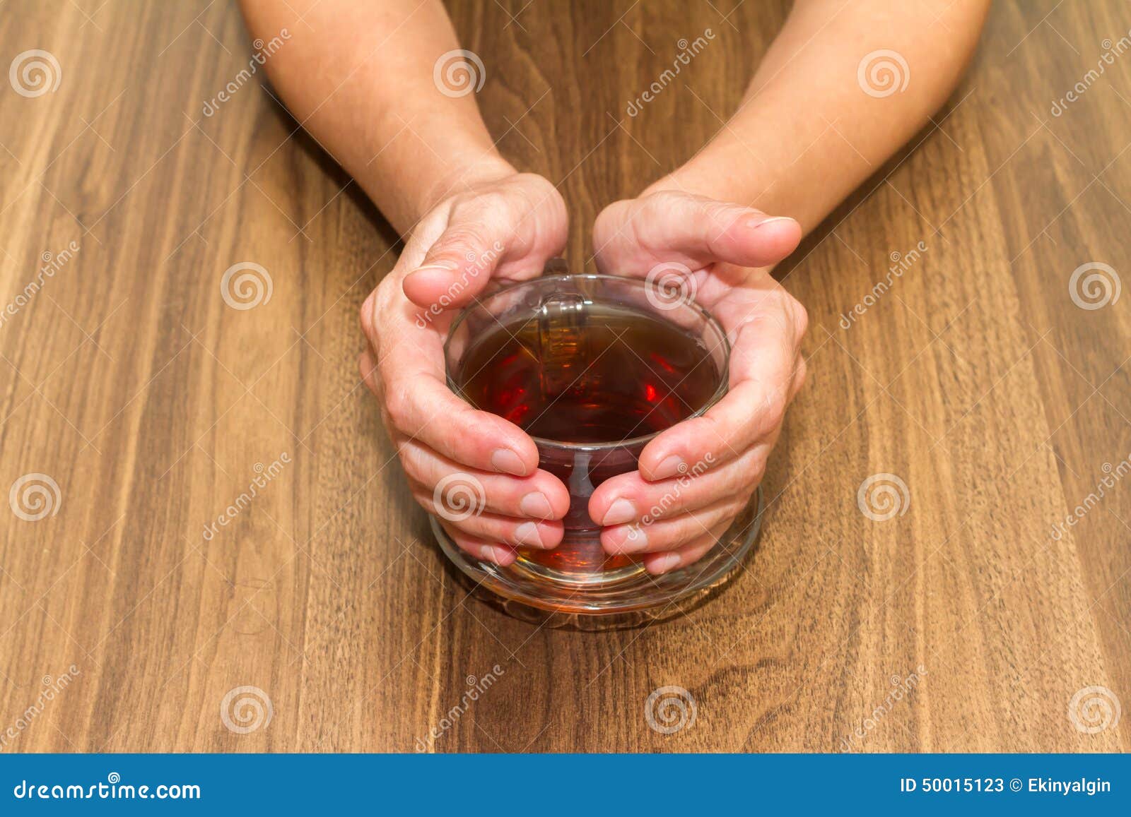 Hands Holding Hot Cup of Tea Stock Image - Image of showing, hand: 50015123