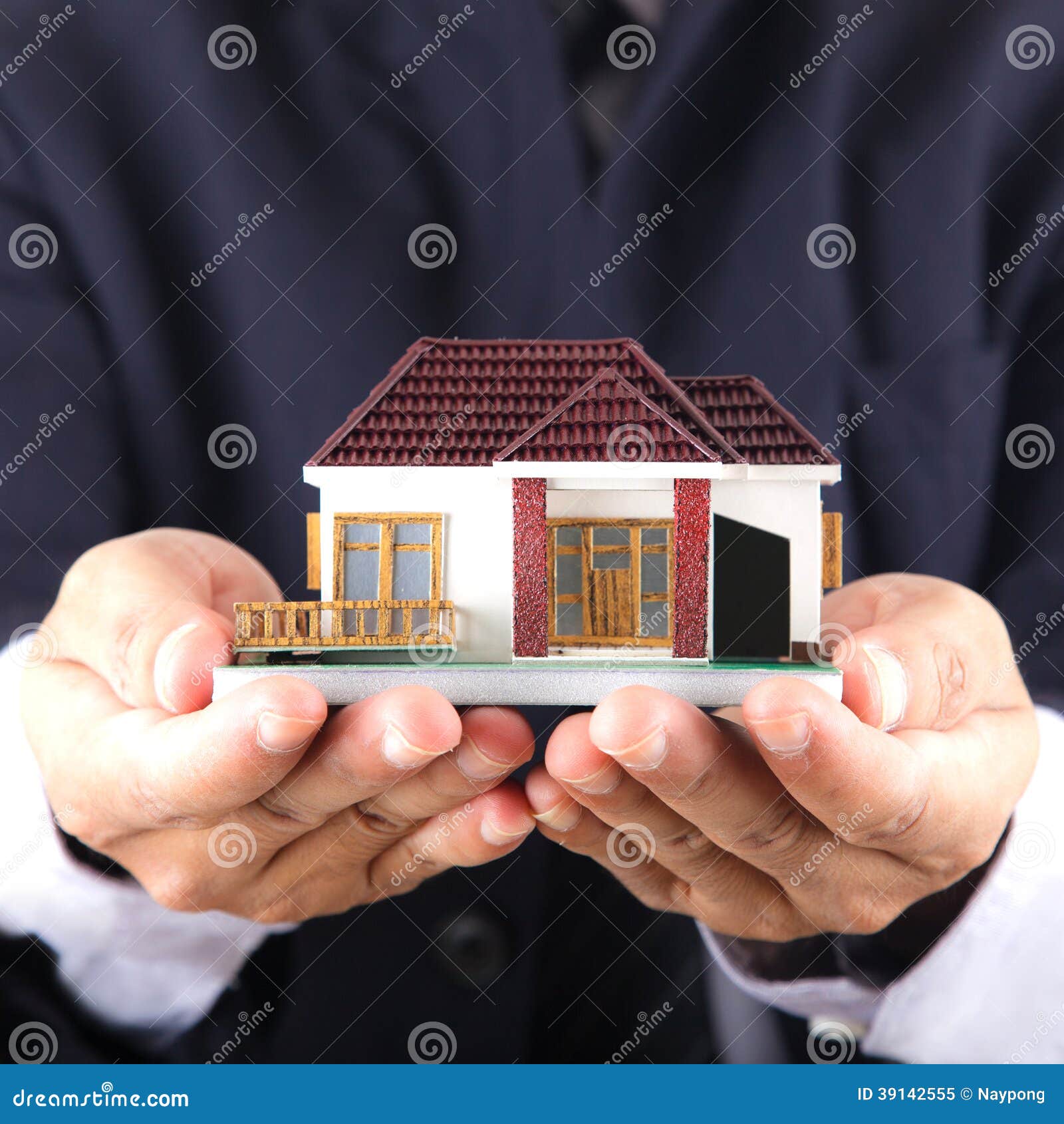 Hands holding house stock image. Image of safe, loan - 39142555