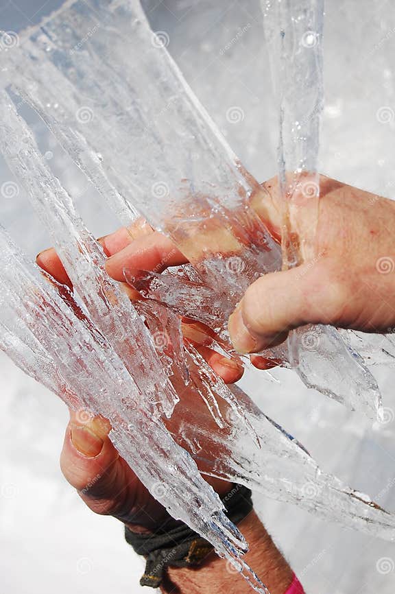 Hands Holding Ice stock image. Image of clear, thumbs - 12850333