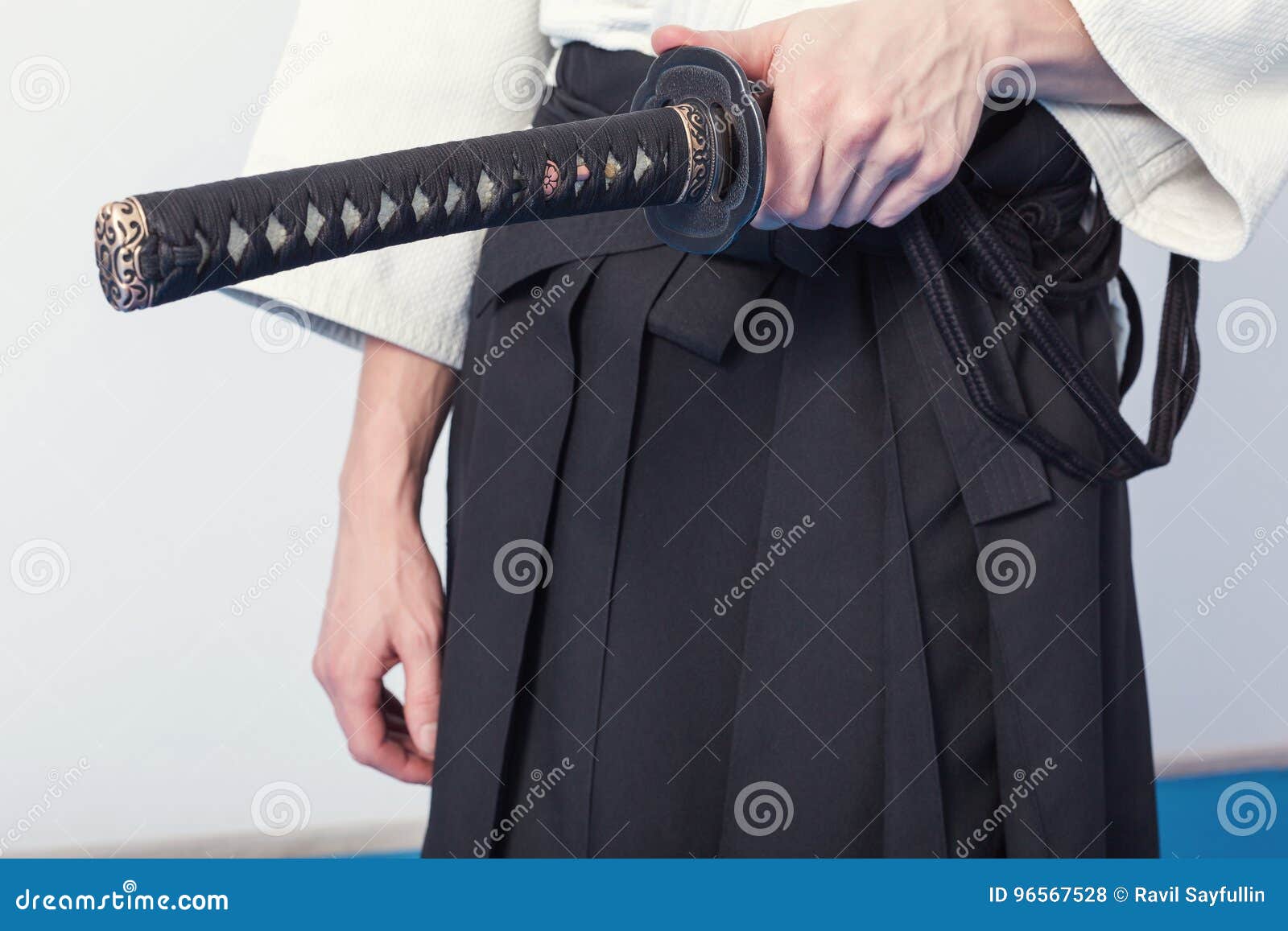 Hands holding the Katana stock photo. Image of japan - 96567528