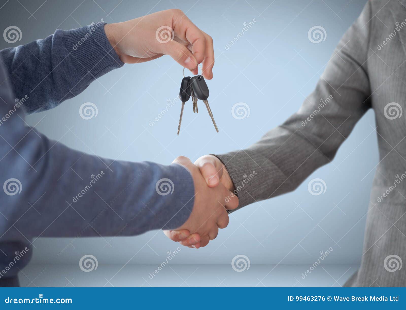 Hands Holding Key in Front of Vignette with Handshake Stock Photo ...