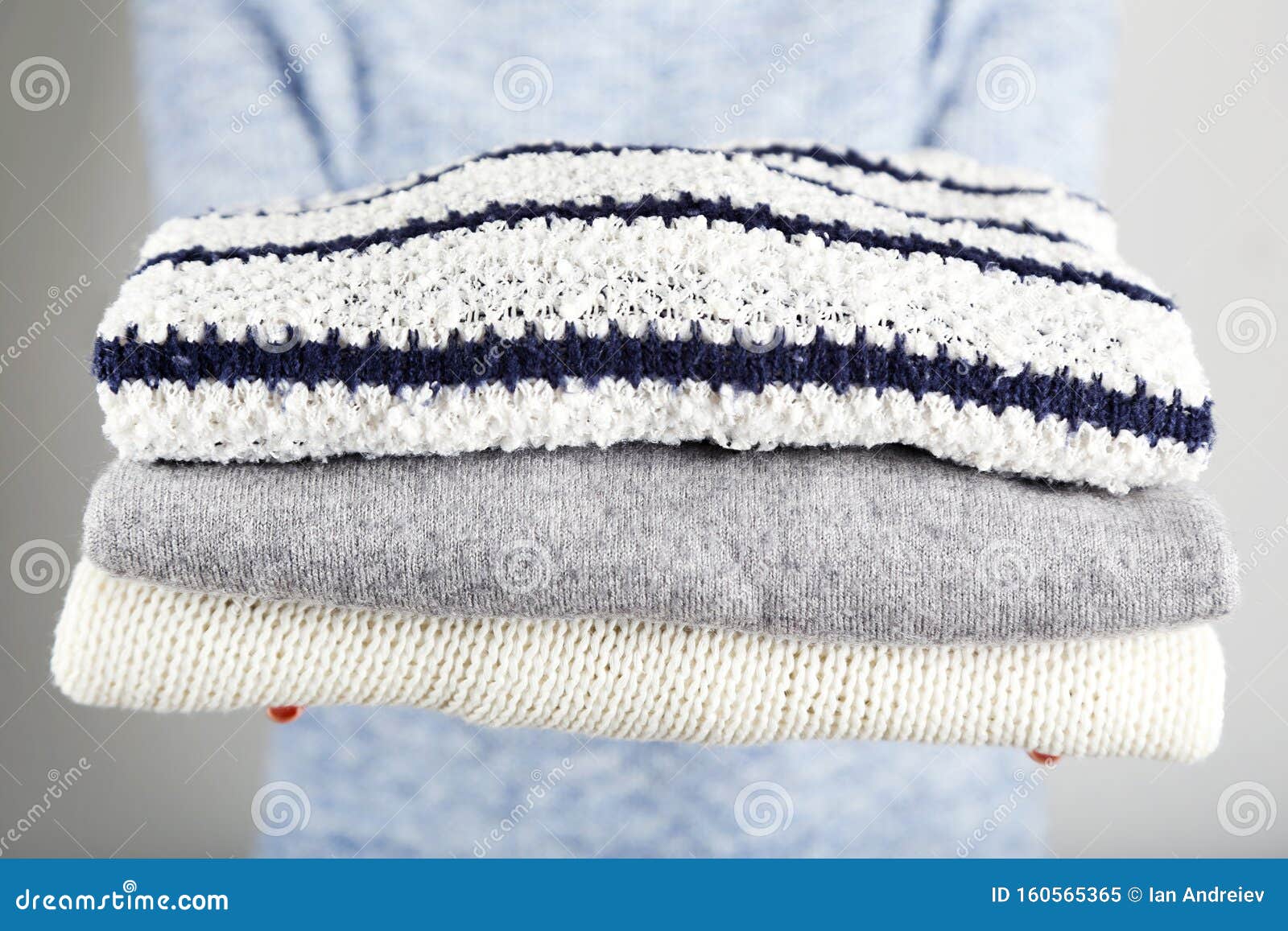 Hands Holding Knitted Sweaters Stock Image - Image of cloth, cozy ...