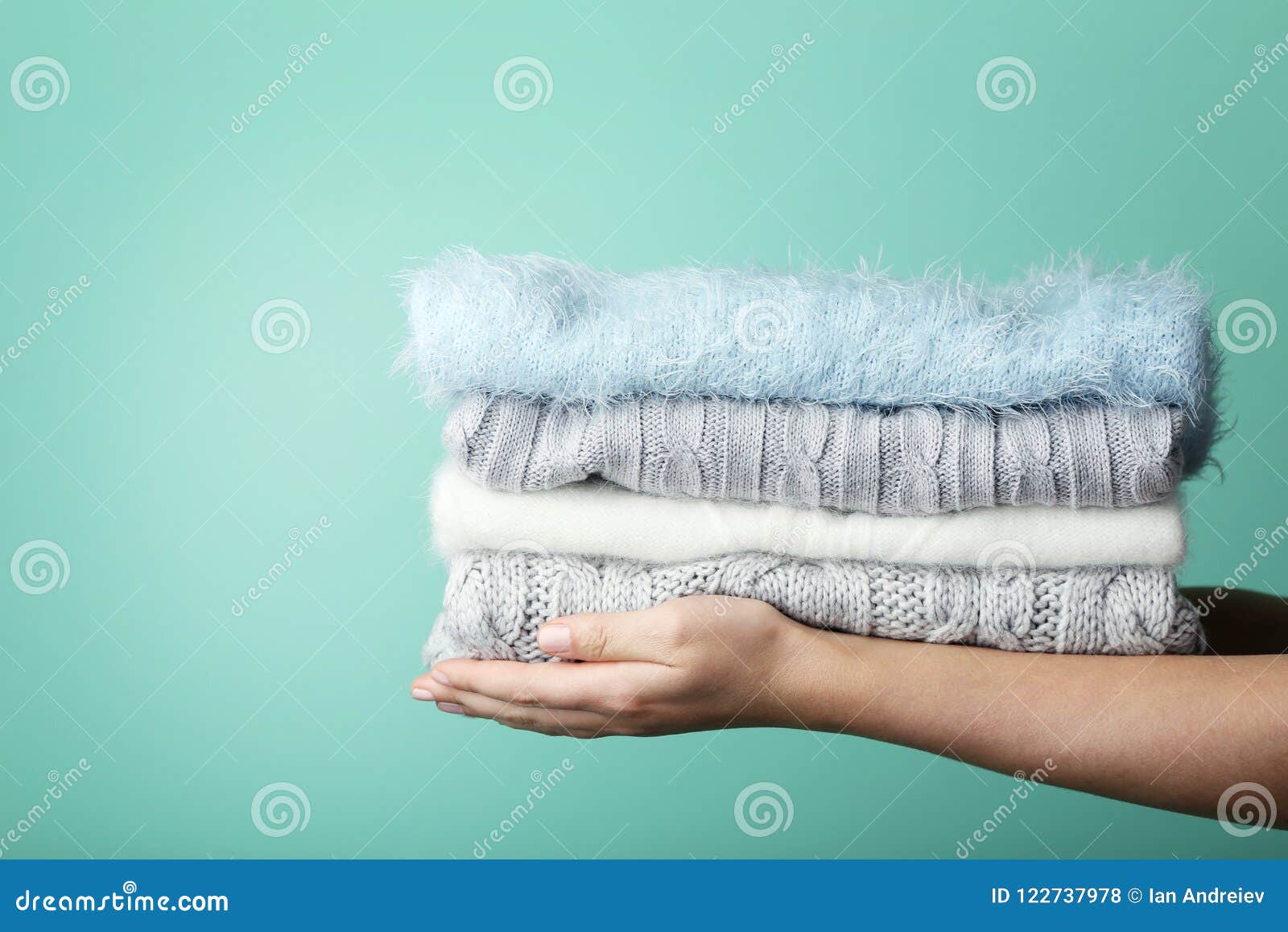 Hands Holding Knitted Sweaters Stock Photo - Image of comfort, knitted ...