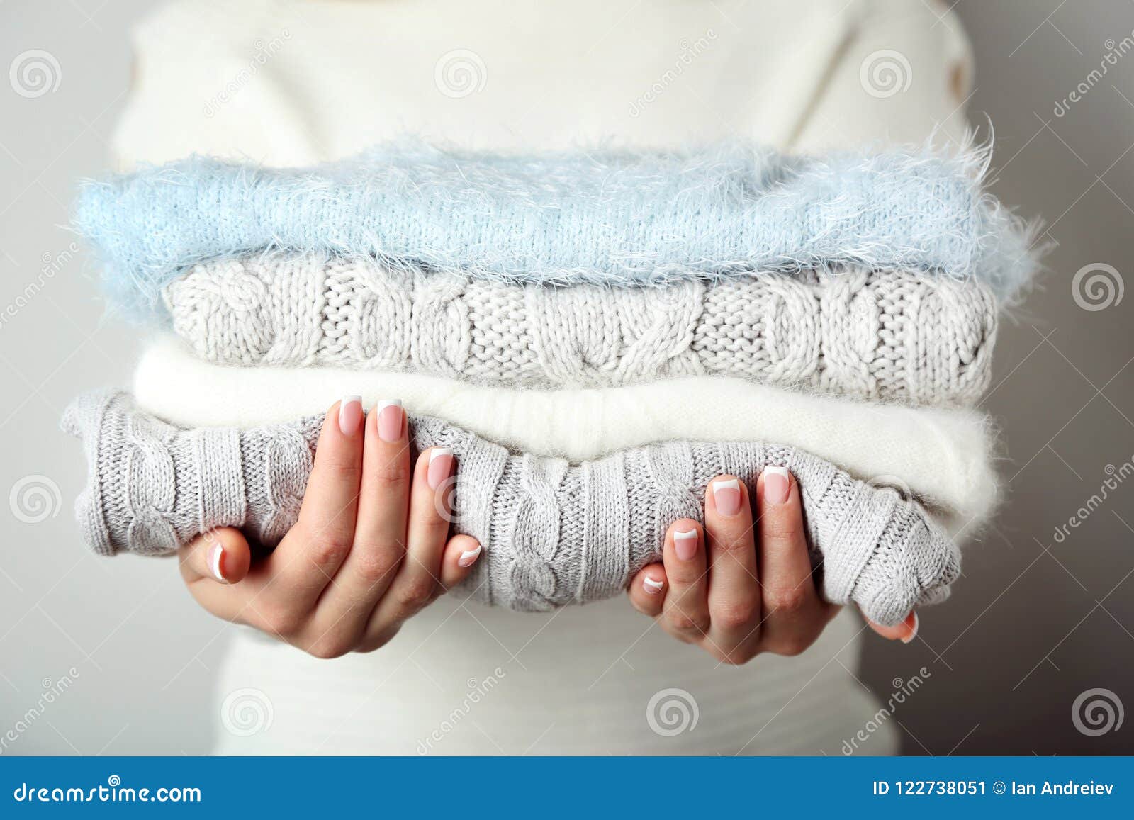 Hands Holding Knitted Sweaters Stock Image - Image of color, hand ...