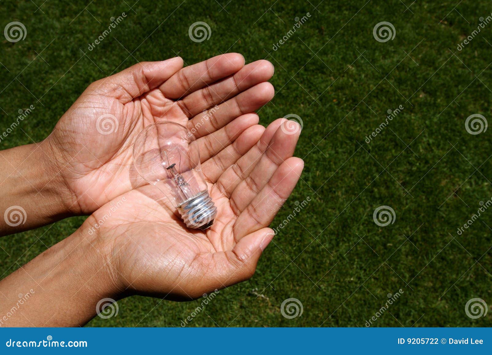Hands holding a light bulb stock photo. Image of fingers - 9205722
