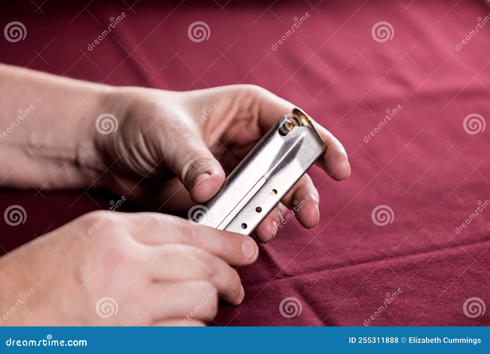 Hands Holding a Loaded Magazine for a Semi-automatic Pistorl Stock ...