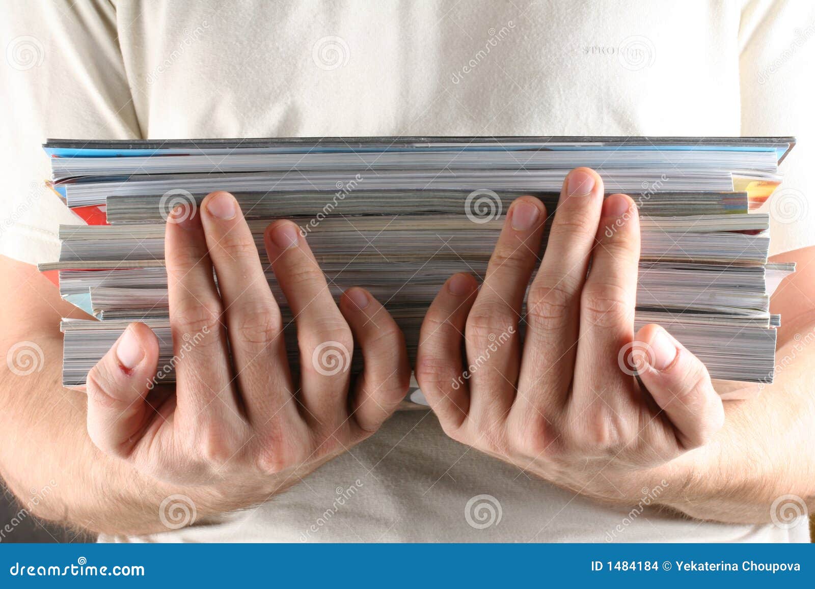 Hands holding magazines stock photo. Image of grip, stack - 1484184
