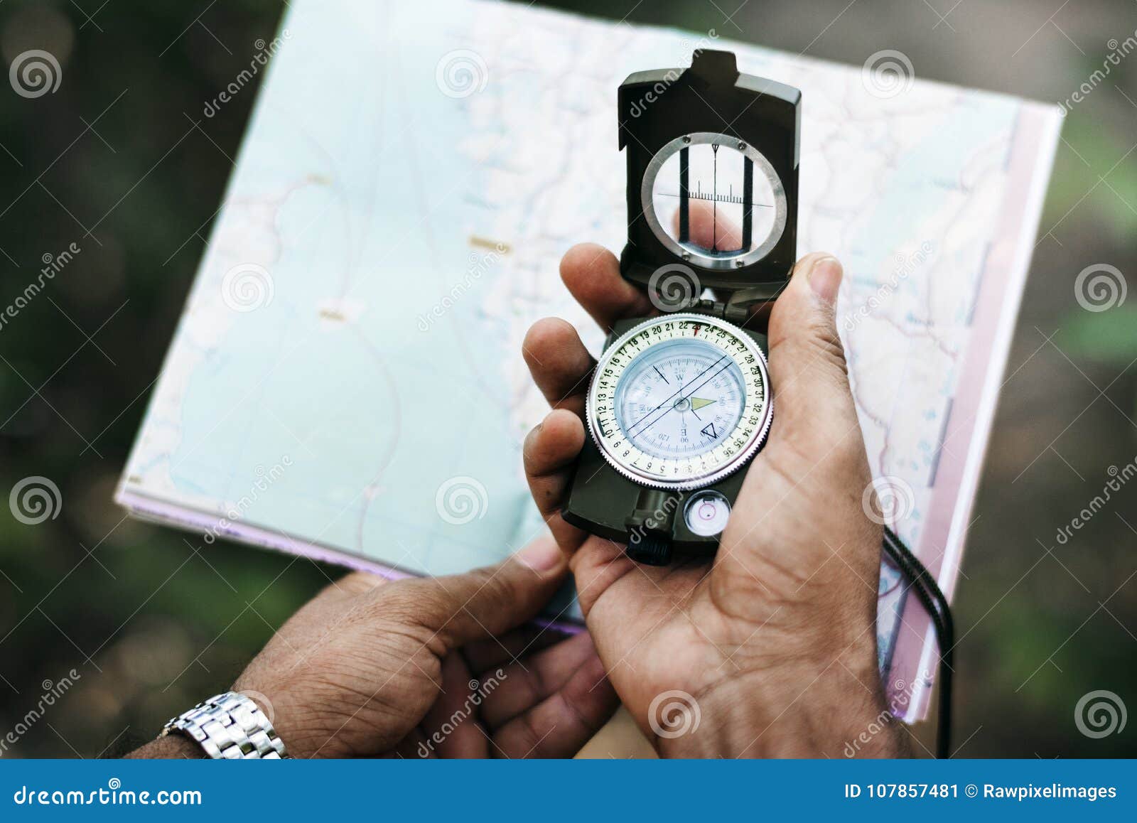 Hands Holding Map and Compass Stock Image - Image of tree, casual ...