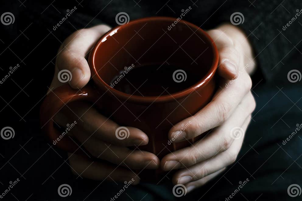 Hands Holding Mug stock image. Image of dark, drink, texture - 83201885