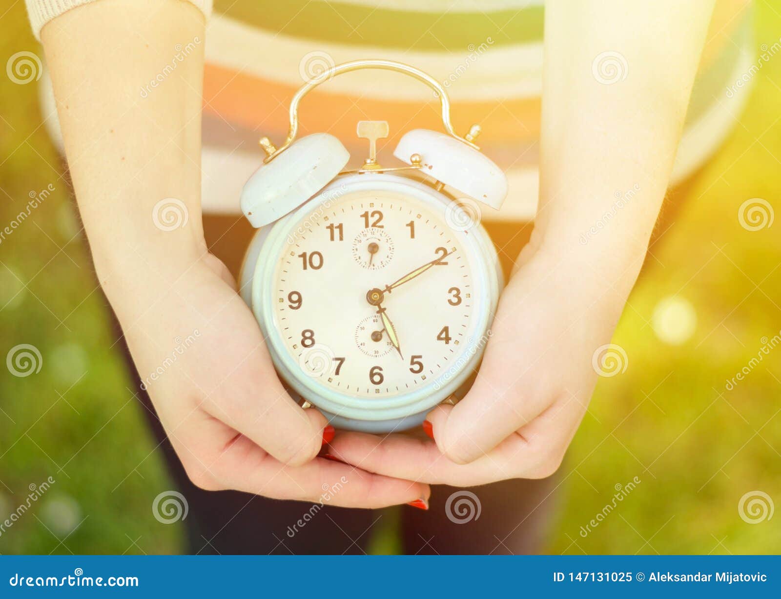 Hands holding old clock stock image. Image of clock - 147131025