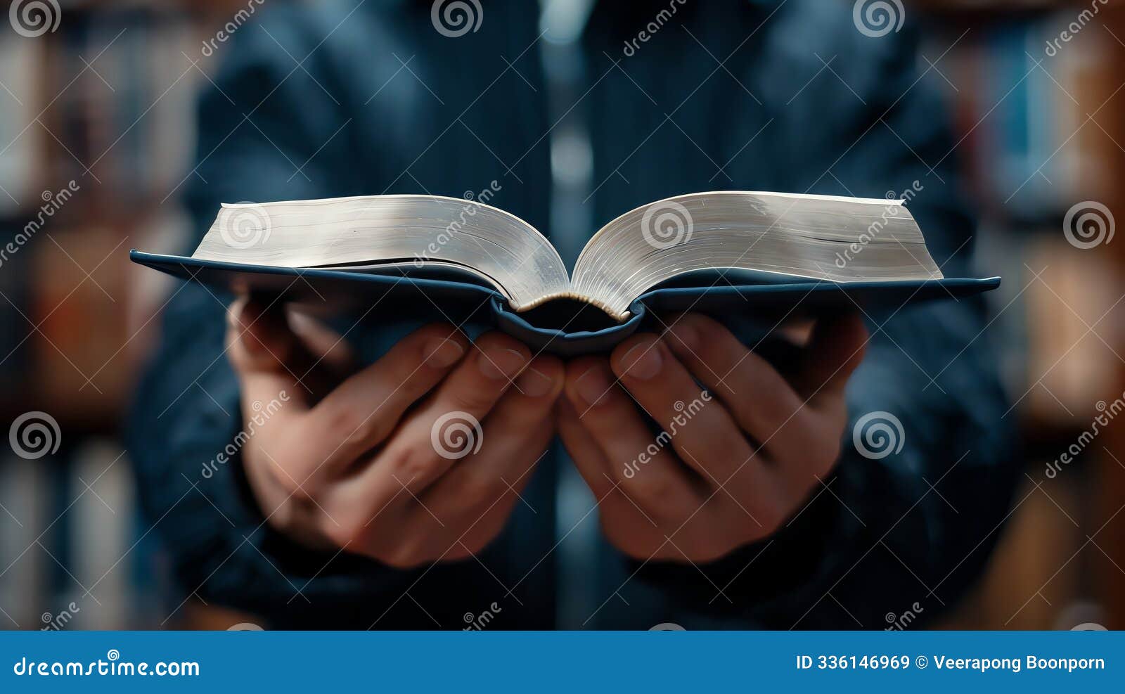 Hands Holding an Open Book in a Library Stock Illustration ...