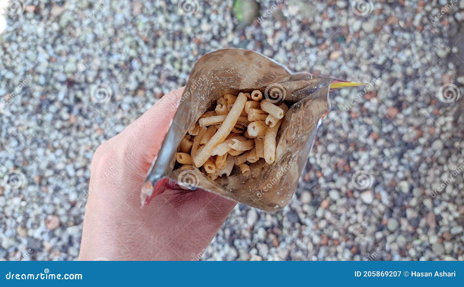Hands are Holding an Open Packet of Snacks Stock Image - Image of hands ...