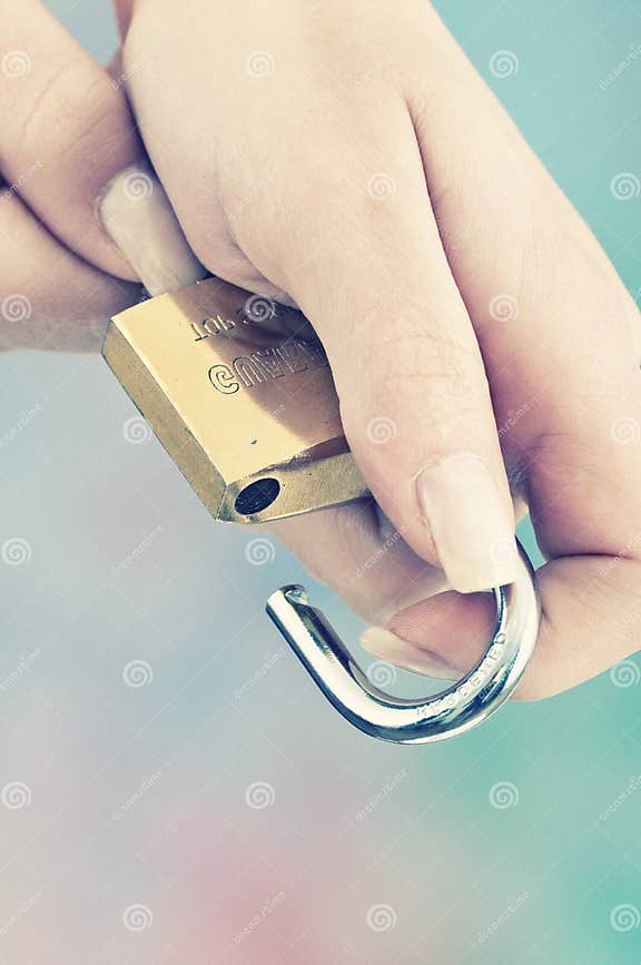 Hands holding padlock stock image. Image of protective - 12730199