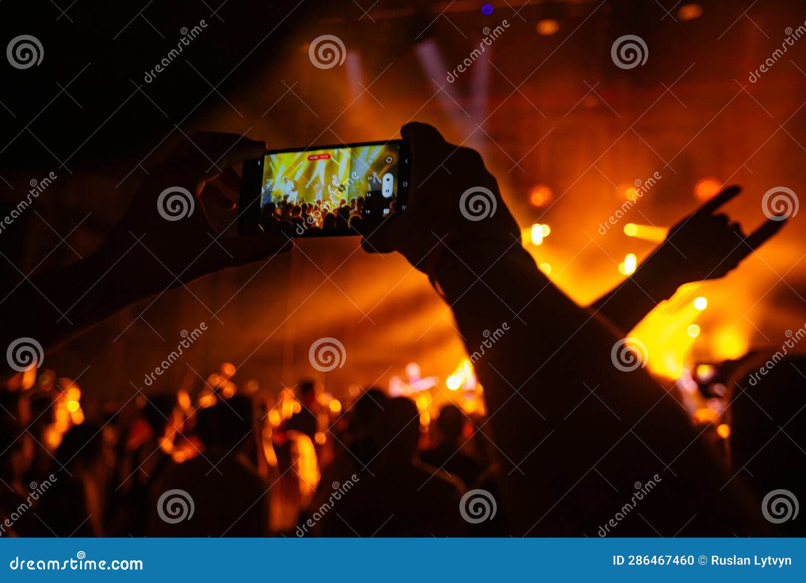 Hands Holding Phone and Making Photos on the Concert Stock Photo ...