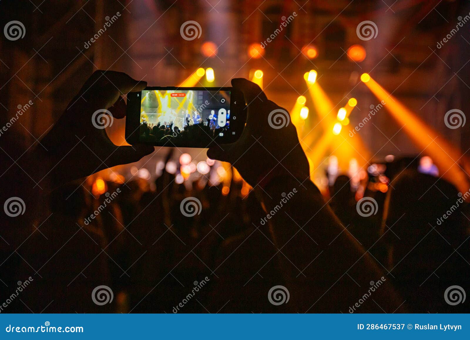 Hands Holding Phone and Making Photos on the Concert Stock Image ...