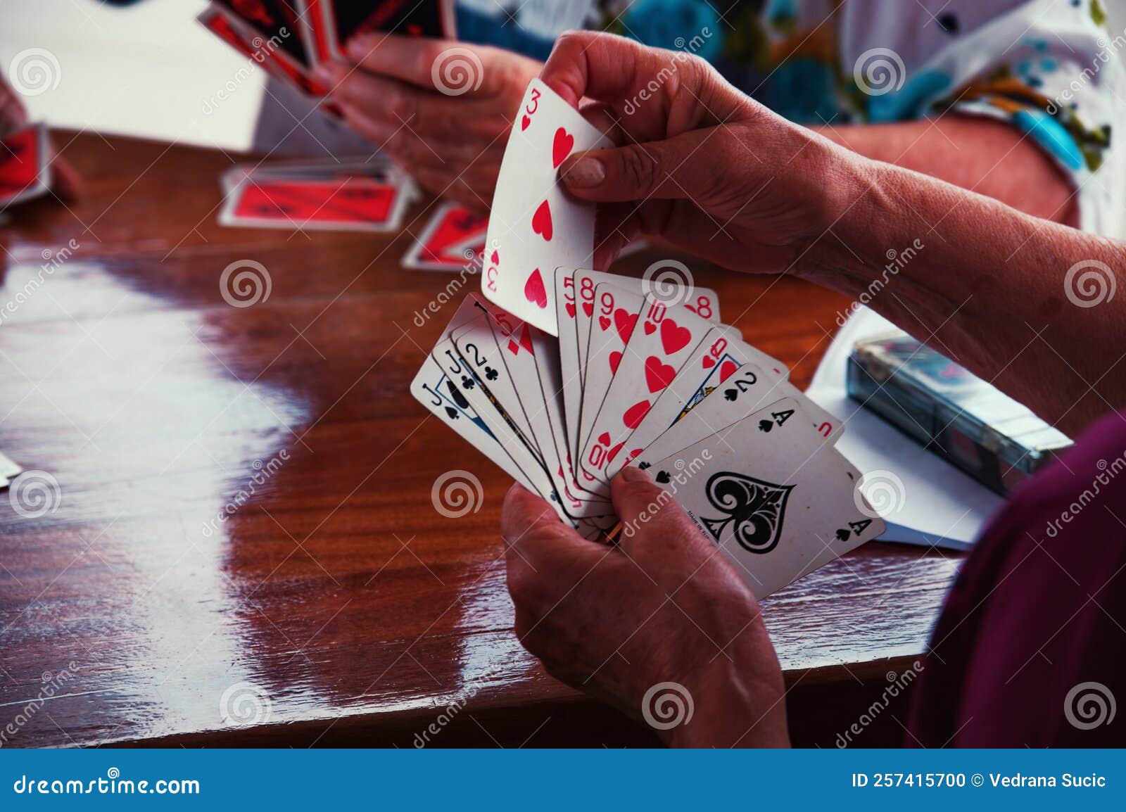 Hands Holding Playing Cards Stock Photo - Image of cards, friends ...