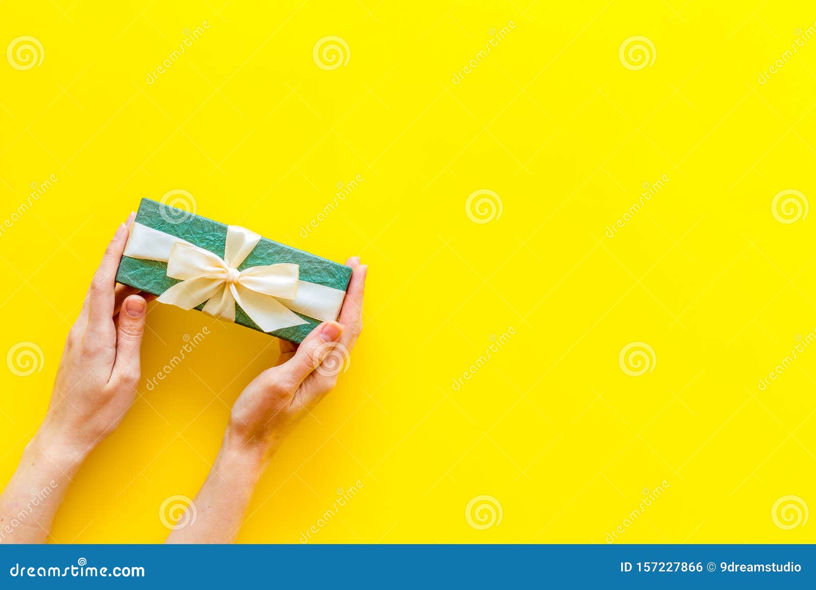 Hands Holding Present in Box on Yellow Background Top View Copyspace ...