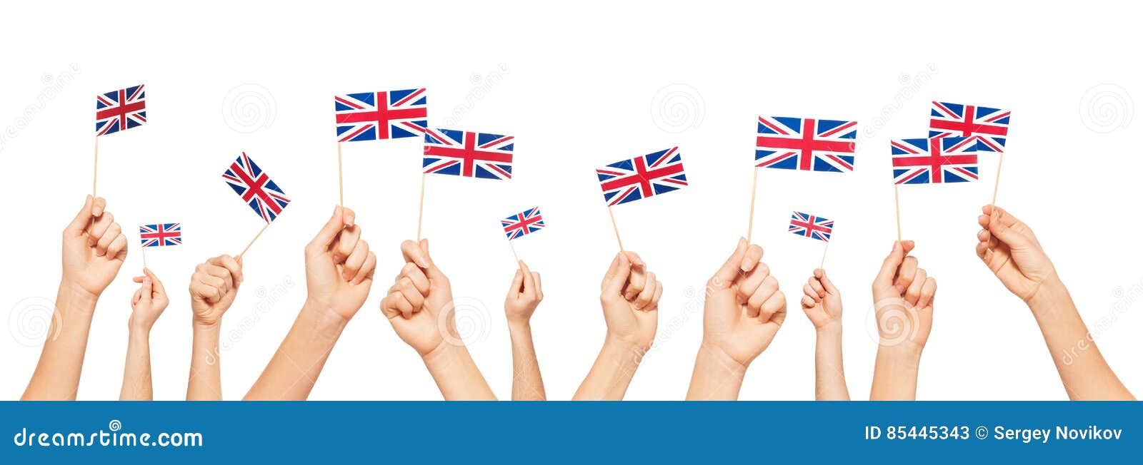 Hands Holding and Raising Flags of Great Britain Stock Image - Image of ...