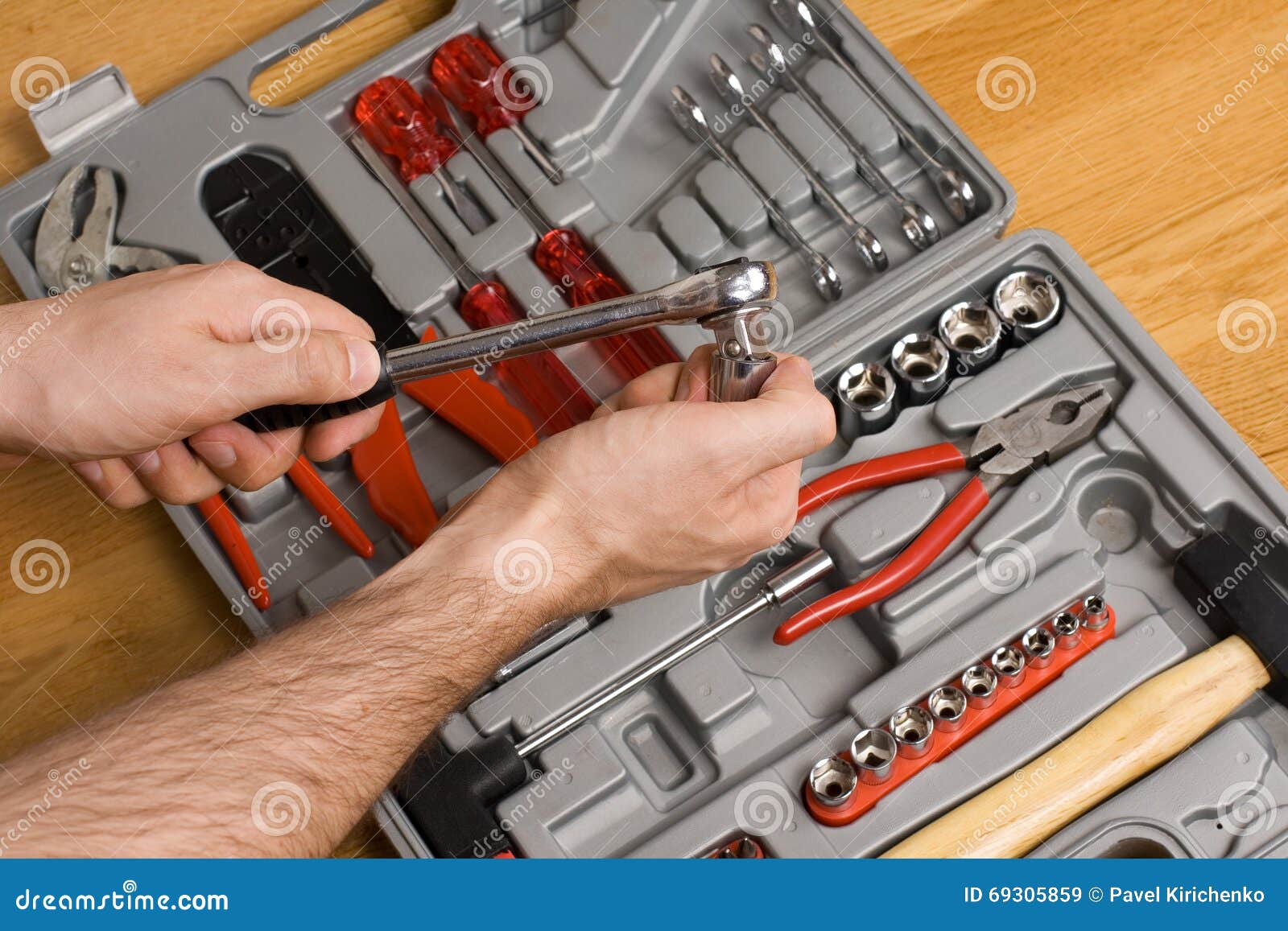 Hands Holding Ratchet and Head Over Toolbox Stock Image - Image of ...