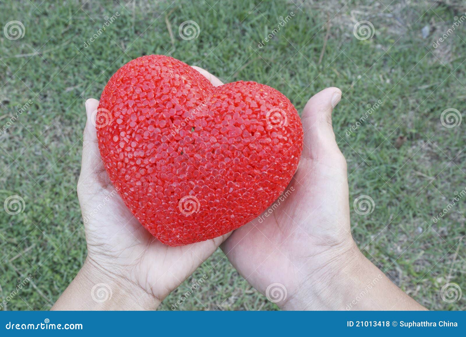 Hands Holding Red Plastic Heart Stock Photo - Image of holding, human ...