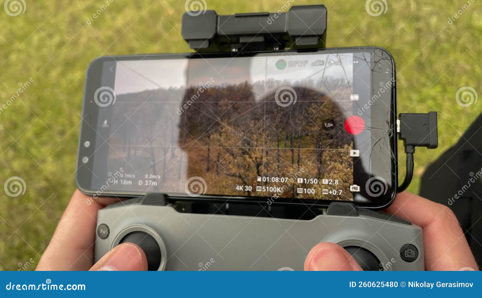 Hands Holding the Remote Control with the Phone from the Drone Stock ...