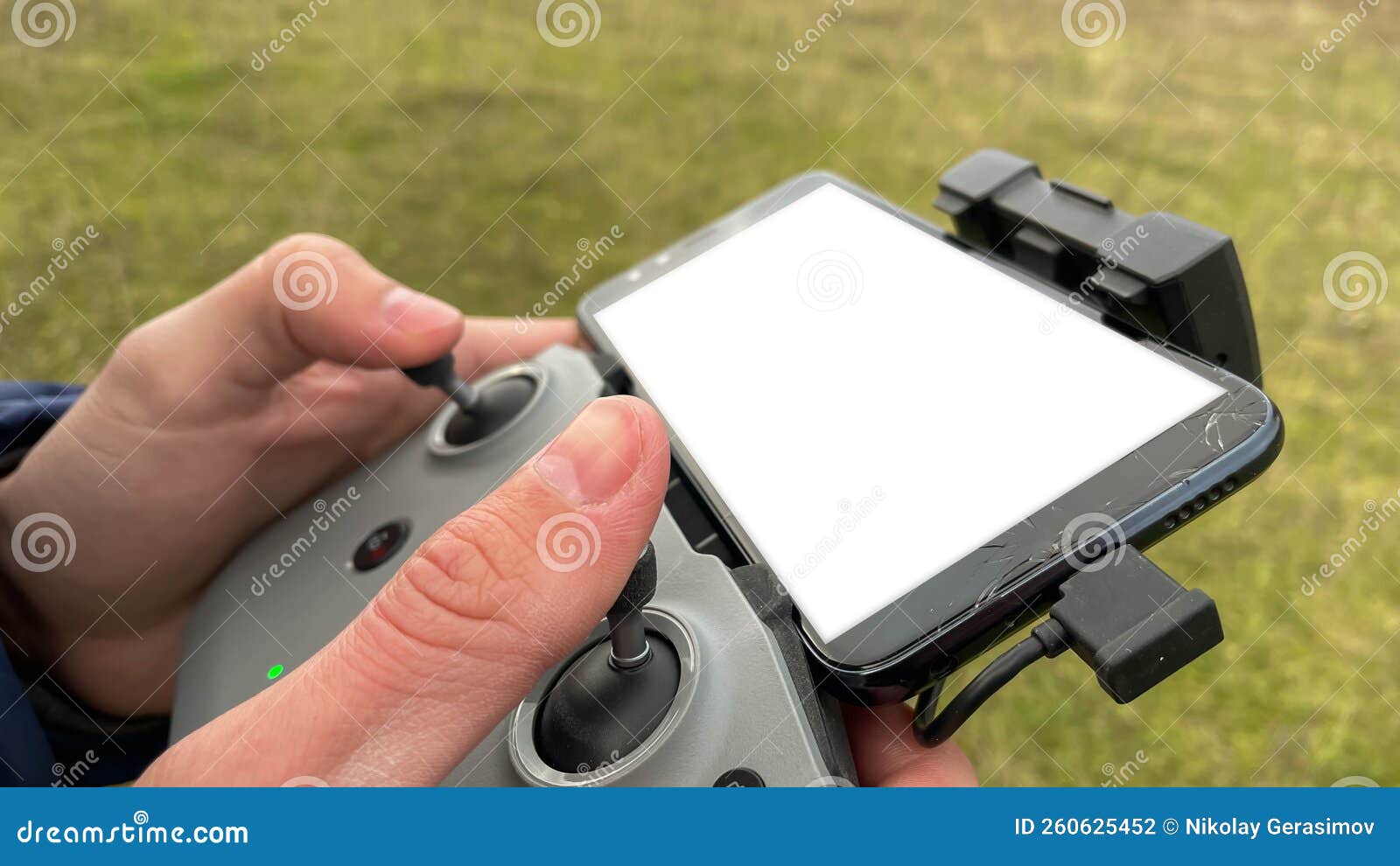 Hands Holding the Remote Control with the Phone from the Drone White ...