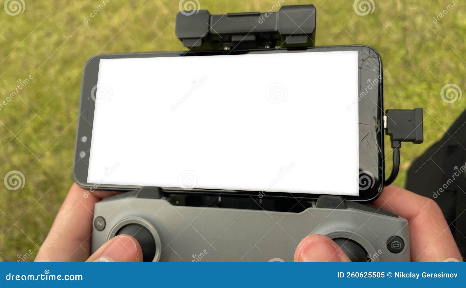 Hands Holding the Remote Control with the Phone from the Drone White ...