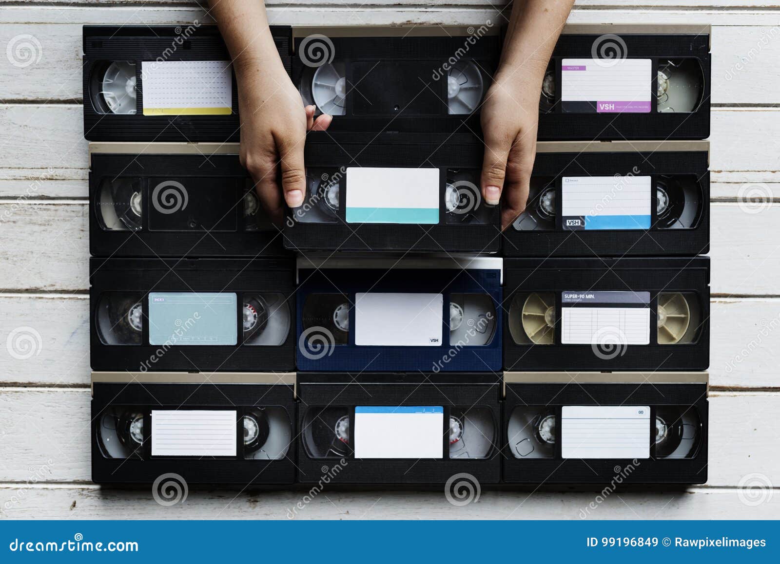 Hands Holding Selecting a Videotape Stock Image - Image of holding ...