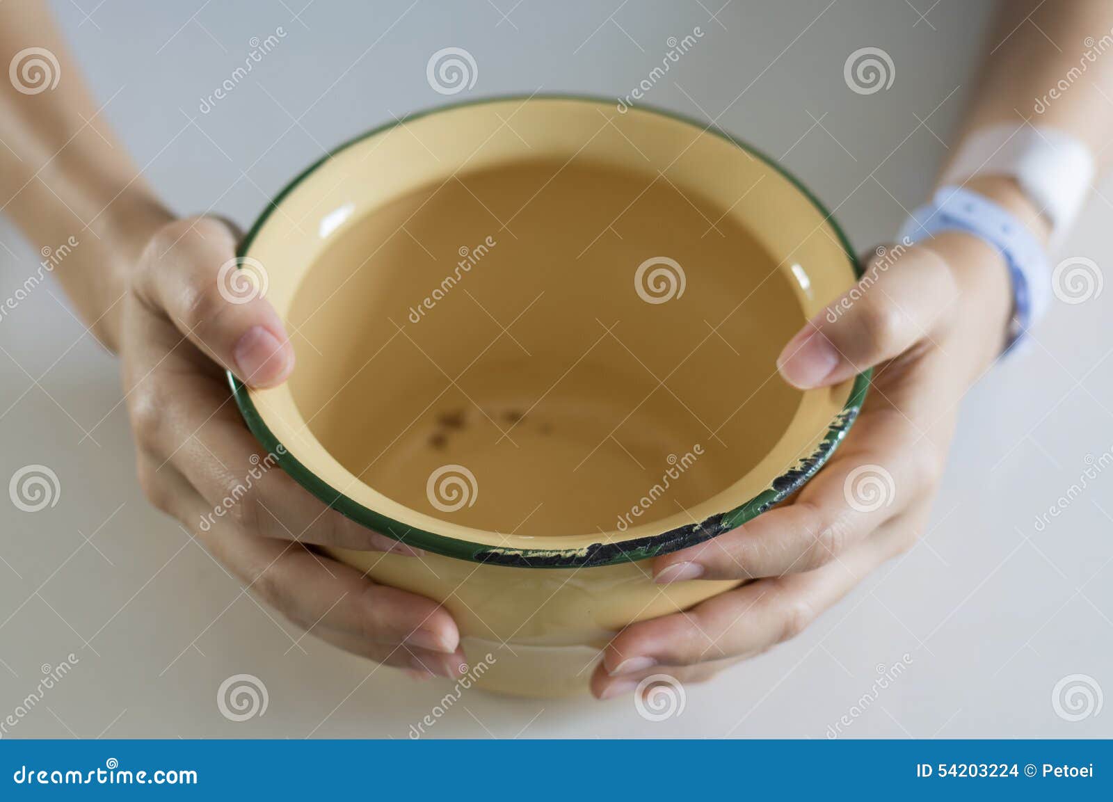 Hands holding a spittoon. stock photo. Image of vomit - 54203224