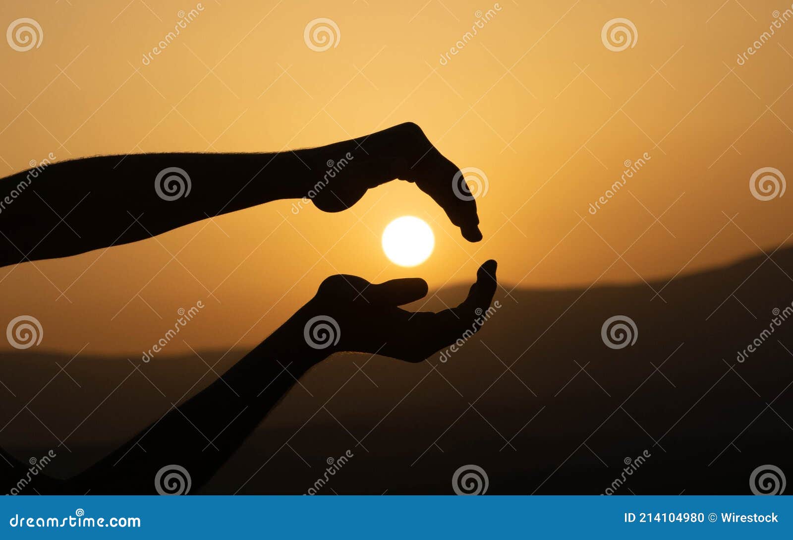 Hands Holding the Sun at Sunset - Perfect for the Background or ...