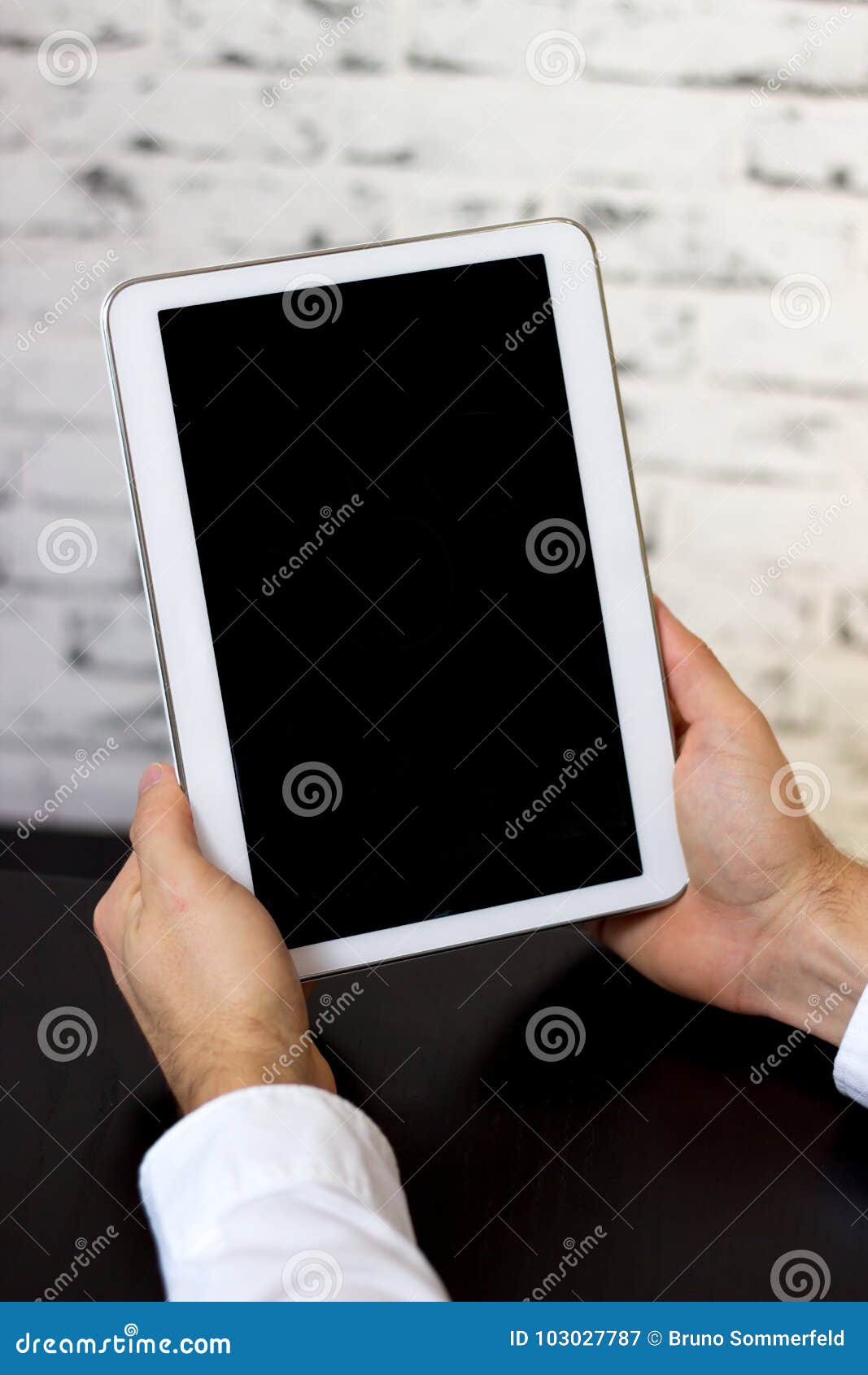 Hands holding a tablet stock image. Image of office - 103027787