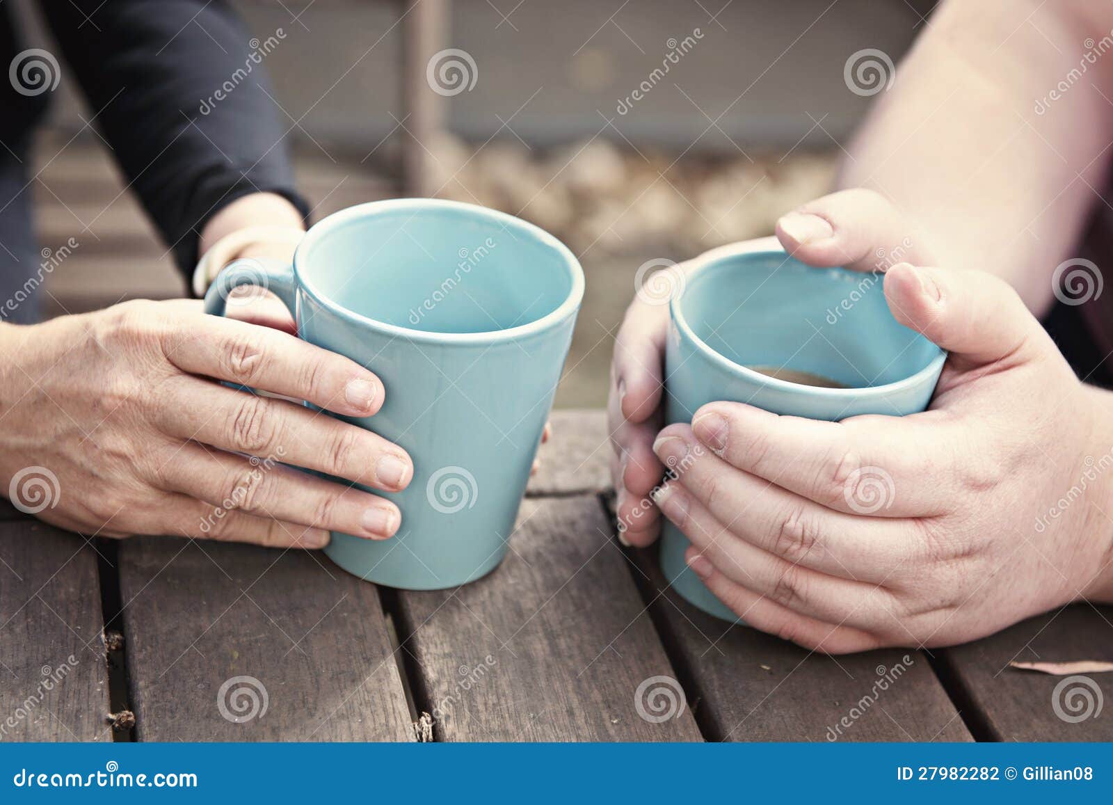 Hands holding teacups stock photo. Image of share, coffee - 27982282