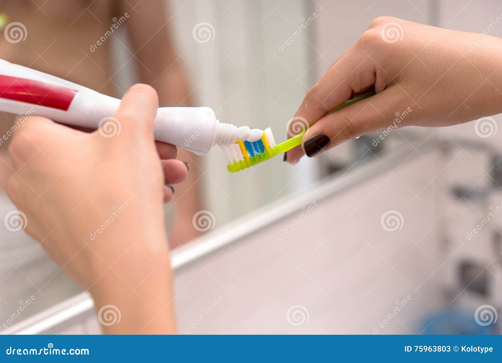 Hands Holding a Toothbrush and Placing Toothpaste on it Stock Image ...