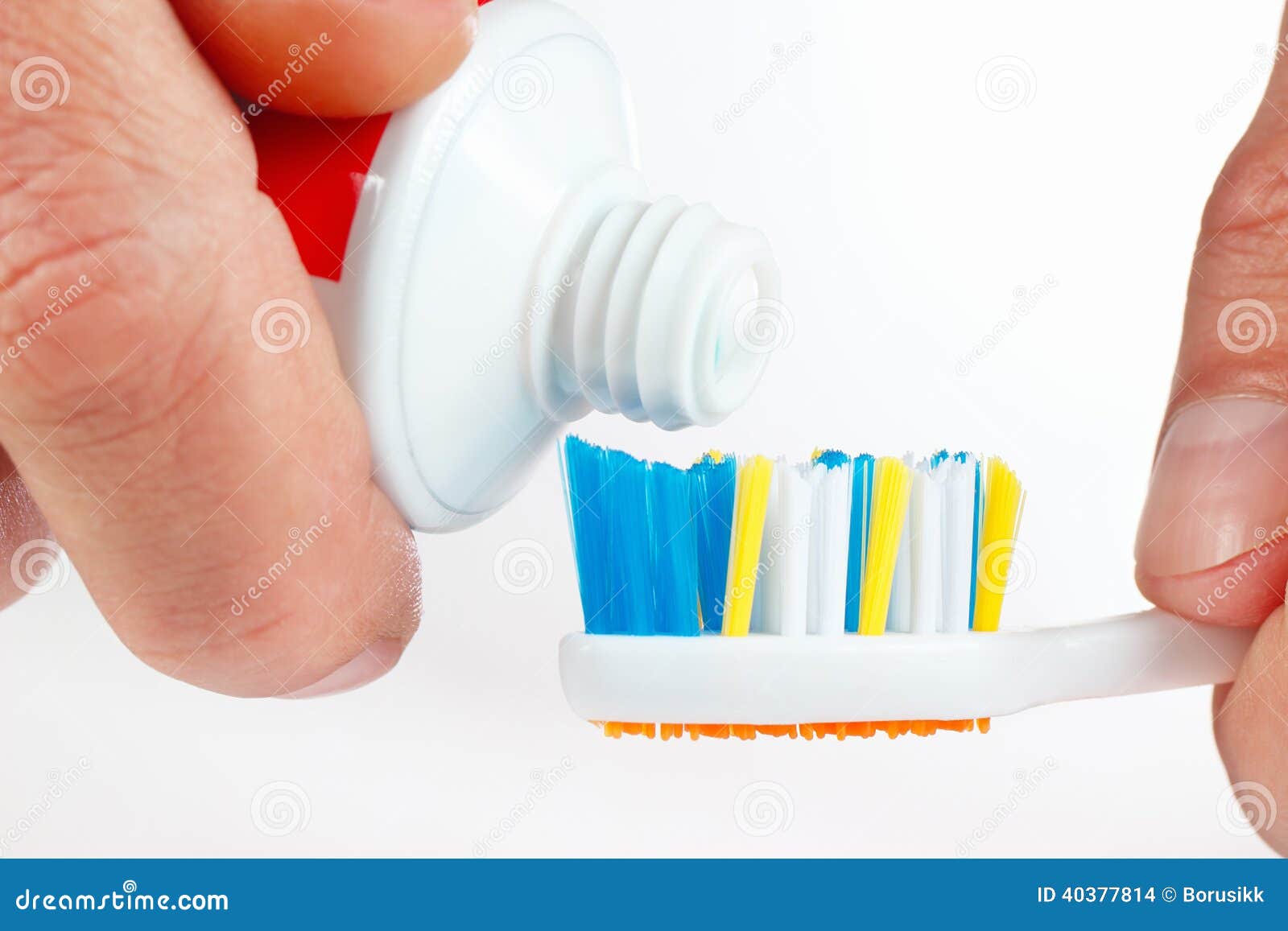 Hands Holding Toothpaste and Toothbrush on White Background Stock Photo ...