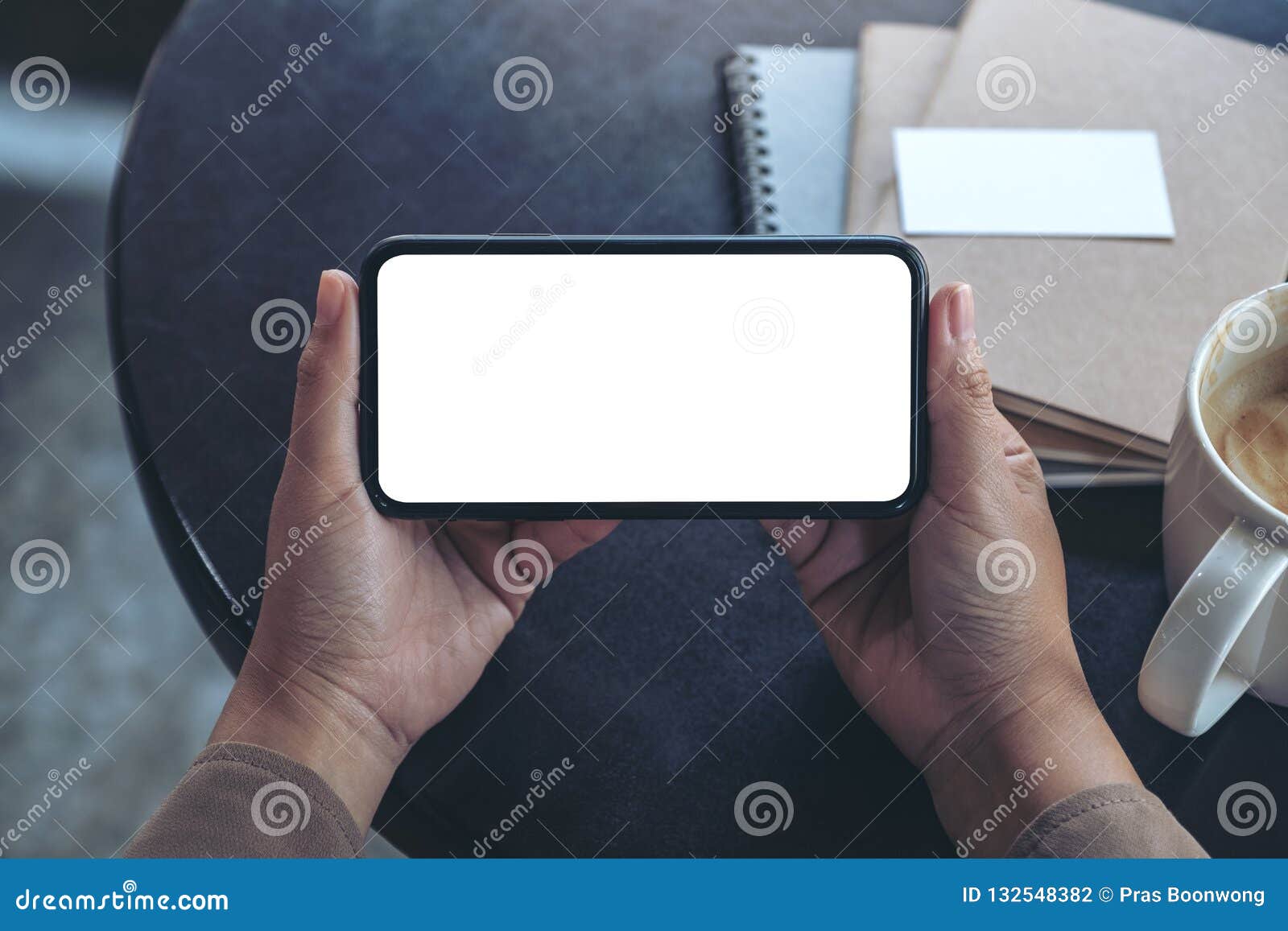 Hands Holding and Using a Black Mobile Phone with Blank Screen ...