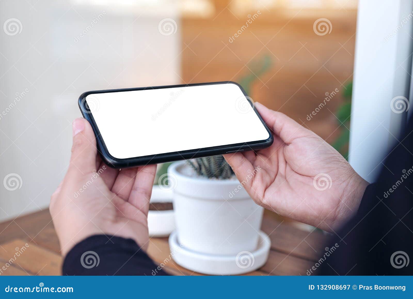 Hands Holding and Using a Black Mobile Phone with Blank Screen ...