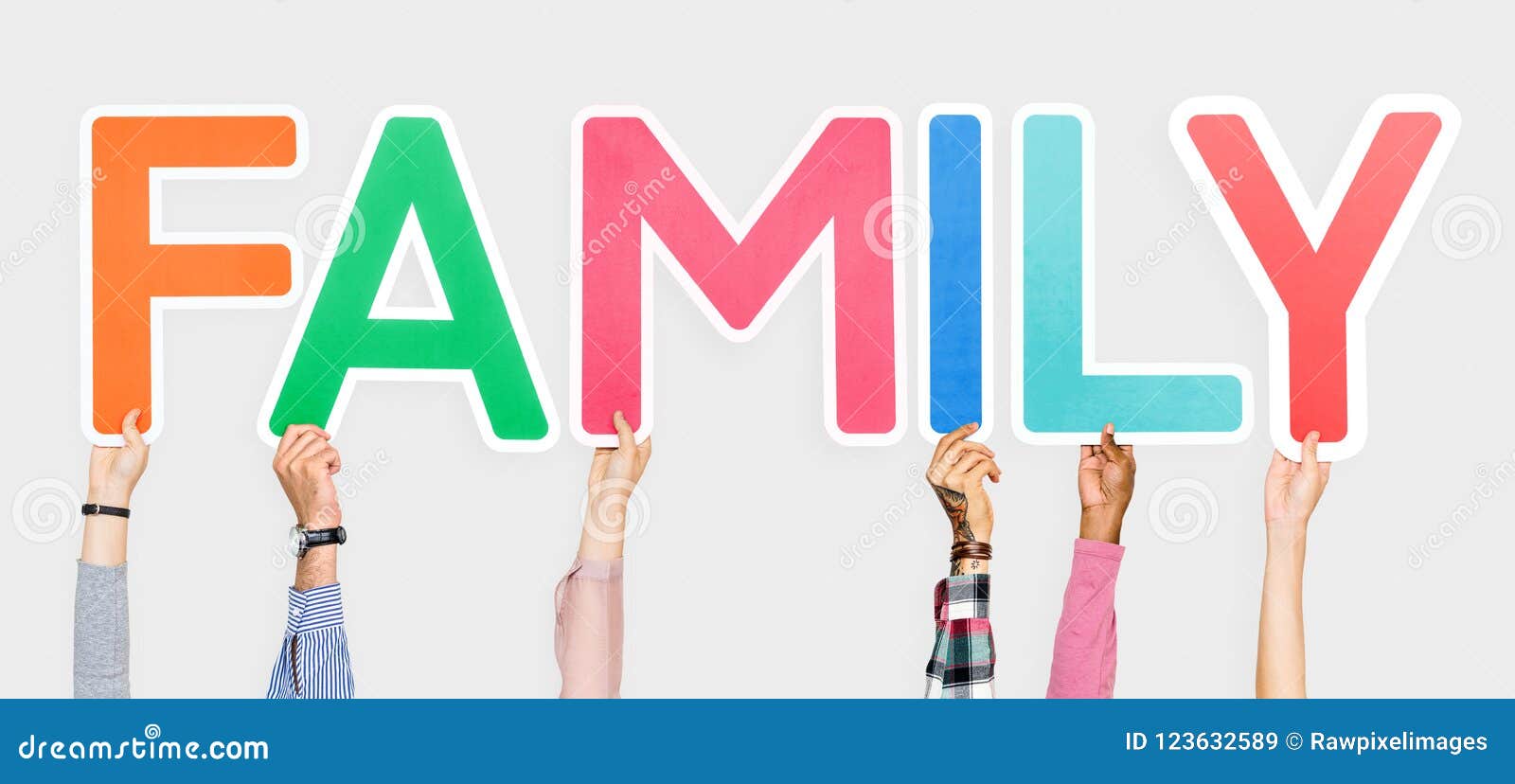 The Word `Family` Made Of White Wooden Letters, And Wedding Rings On A ...