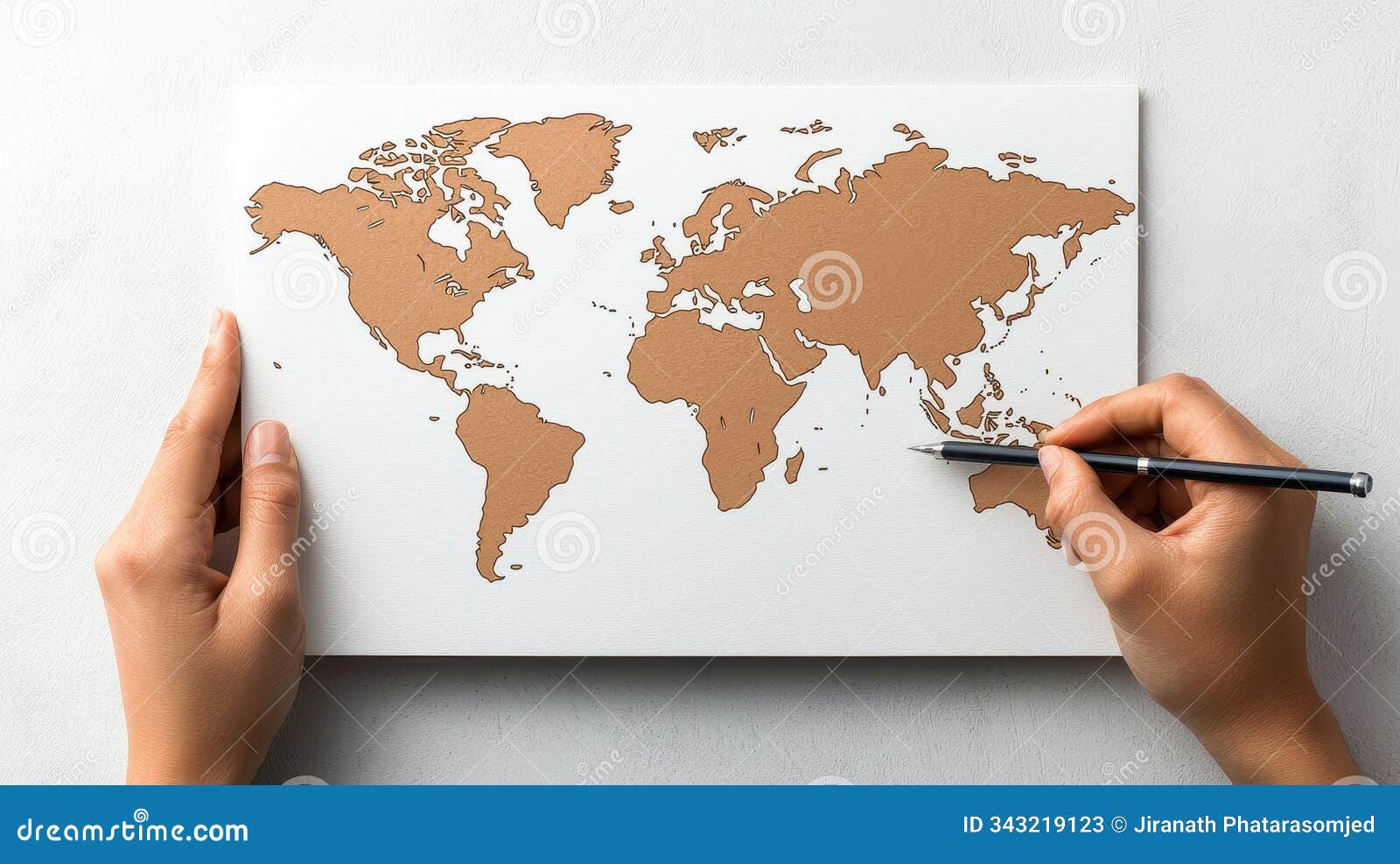 Hands Holding World Map, Drawing on it with Pencil, Showcasing Global ...