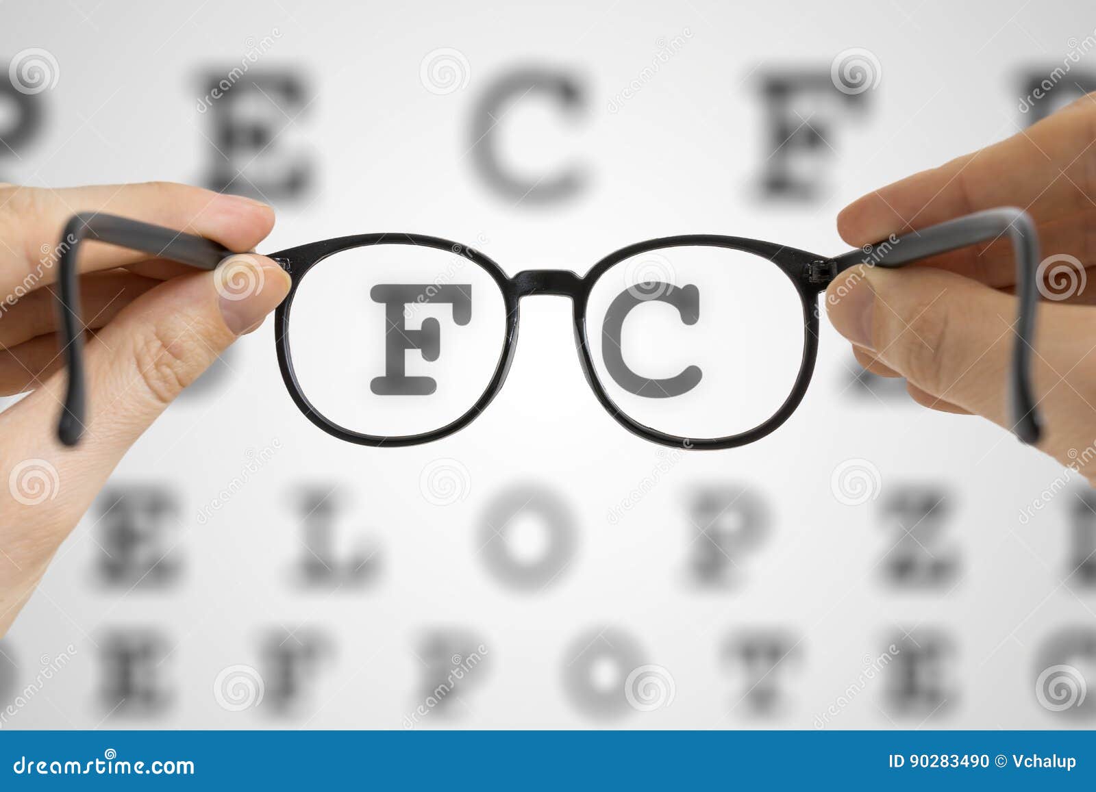 Hands Holds Black Glasses in Front of Vision Testing Chart. Eye Sight ...