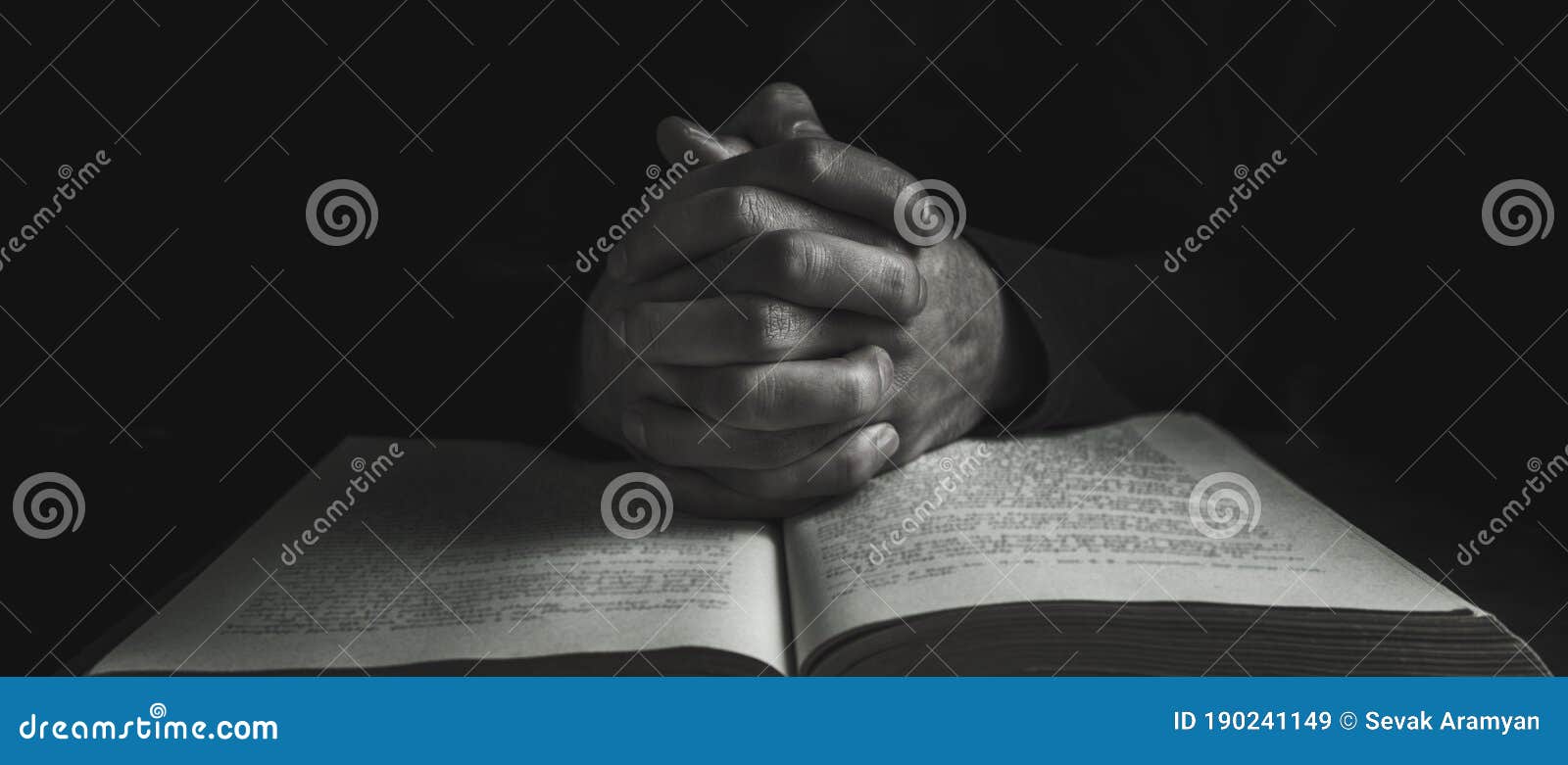Hands of a Human in Prayer on a Holy Bible Stock Image - Image of holy ...