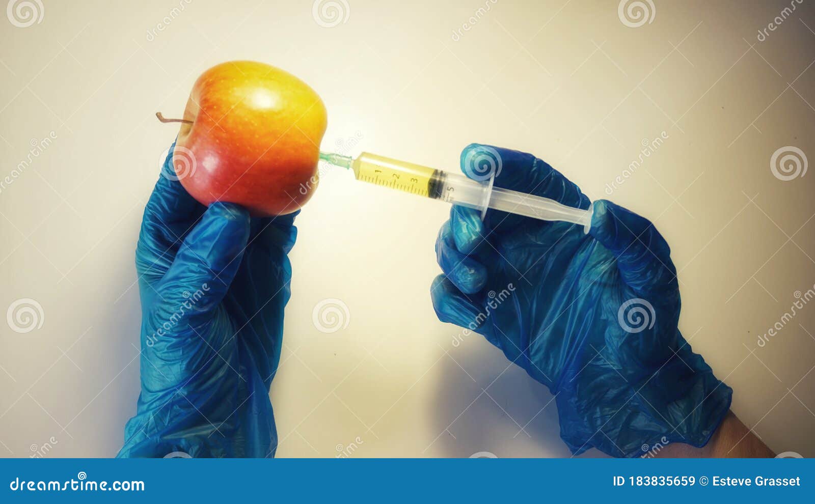 Hands Injecting into an Apple Fruit Stock Image - Image of fruit ...