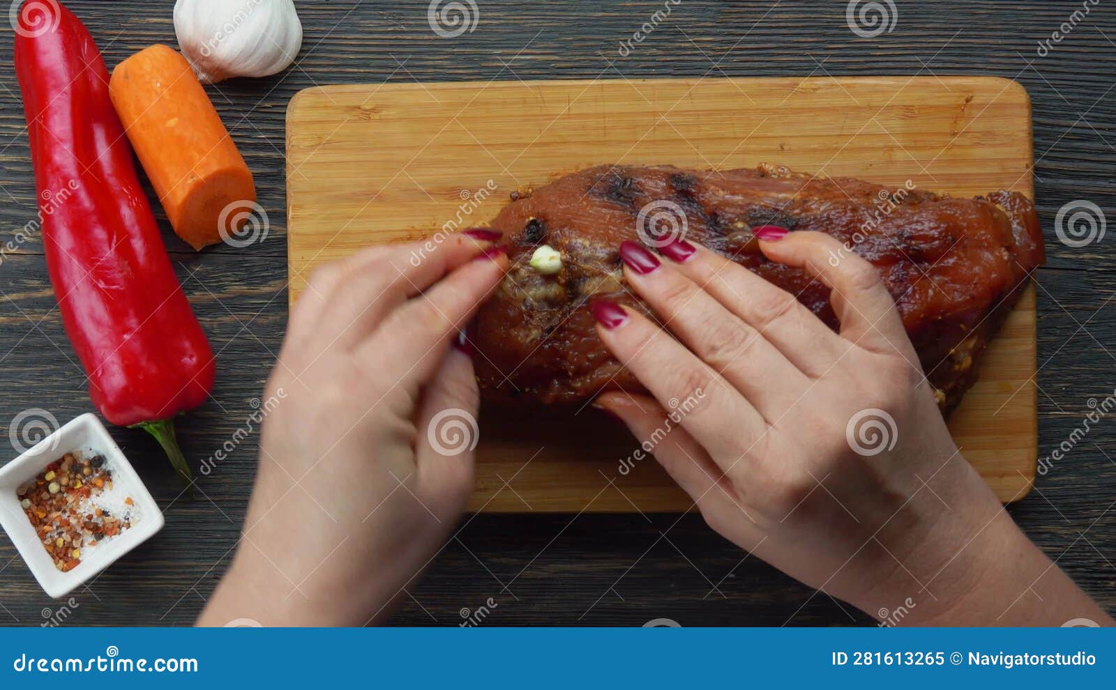 Hands Inserting Pieces of Vegetables into a Marinated Fillet Stock ...