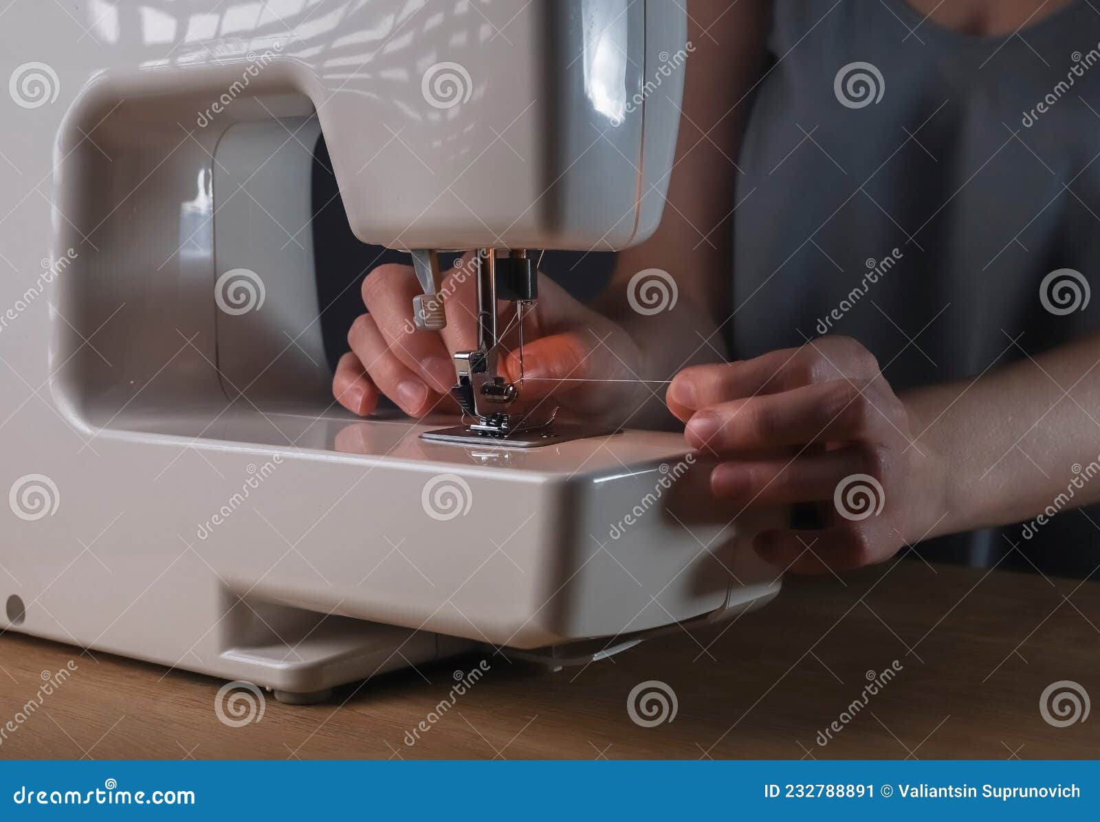 Hands Inserting Thread through Needle Hole in Sewing Machine, Details ...