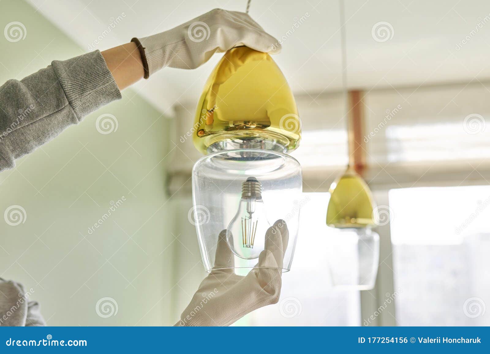Hands Installing LED Bulb in Lamp, Chandelier Stock Photo - Image of ...