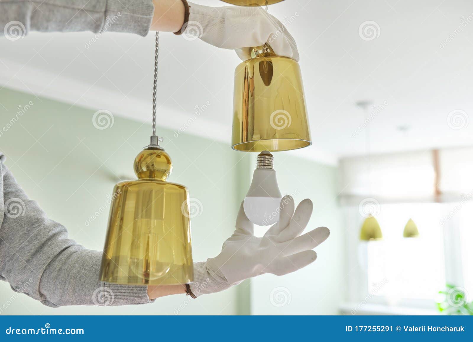 Hands Installing LED Bulb in Lamp, Chandelier Stock Image - Image of ...