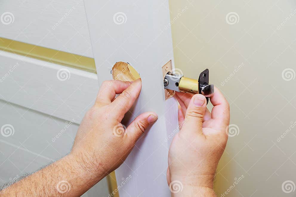 Door Lock Installation Process with Hands Fixing a Lock Cylinder at ...