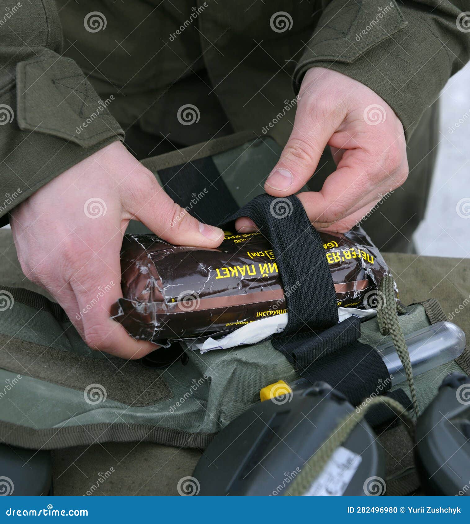Hands of Instructing Officer Holding First-aid Kit Pack Showing Its ...