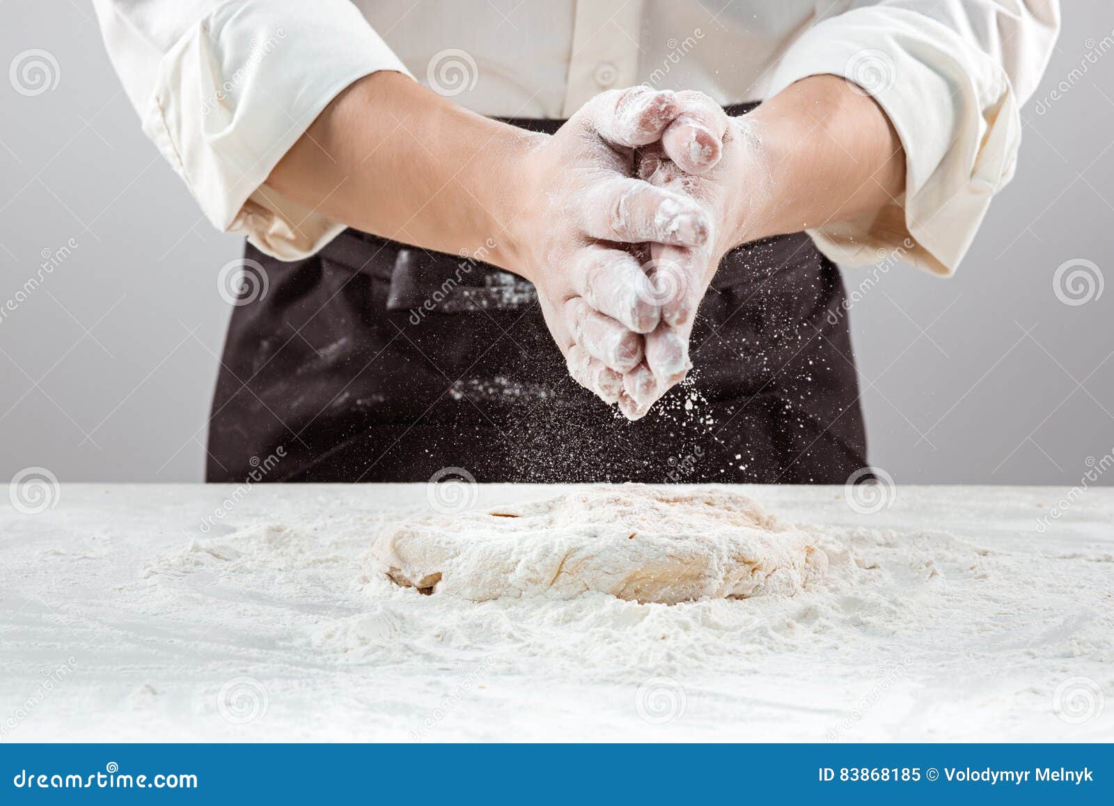 Hands kneading a dough stock image. Image of board, bake - 83868185