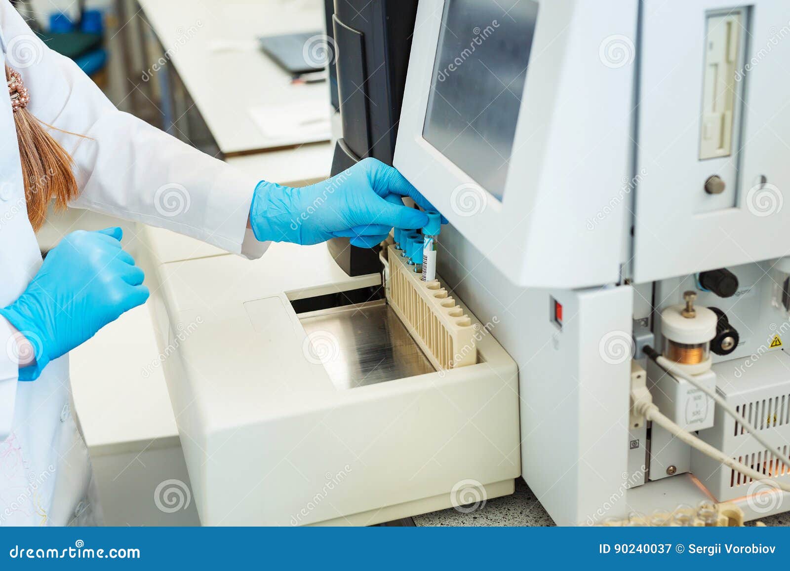 Hands of Laboratory Assistant Loading Sample Tubes for Coagulation Test ...